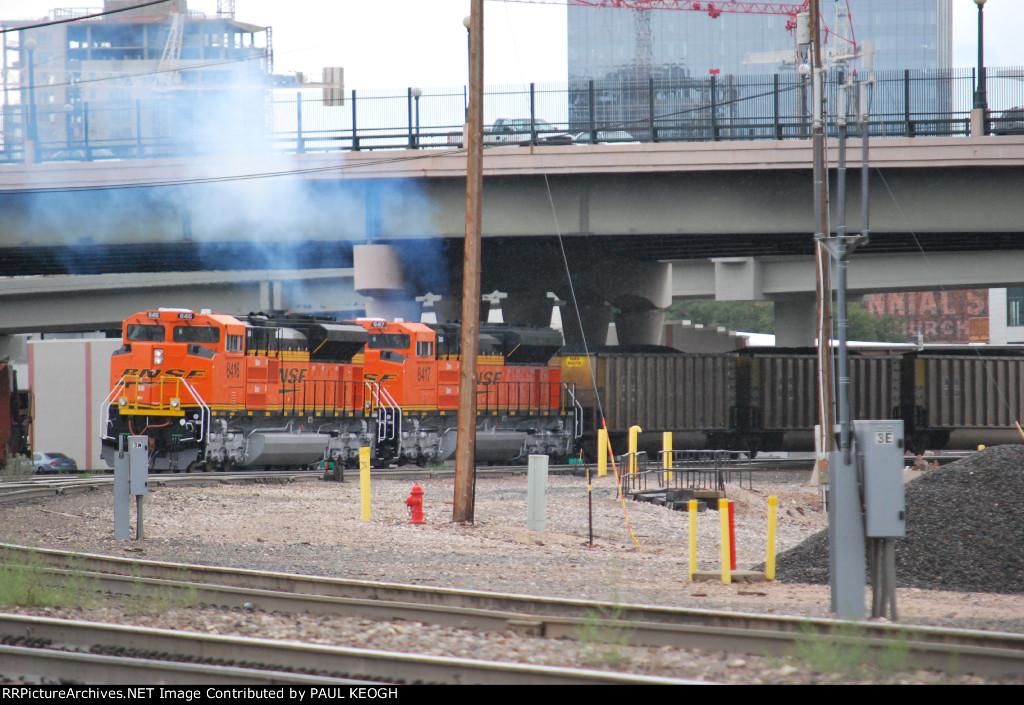 BNSF 8417 and BNSF 8416 Head South as BNSF 8417 Lead Rear DPU still putting out Gray Smoke.